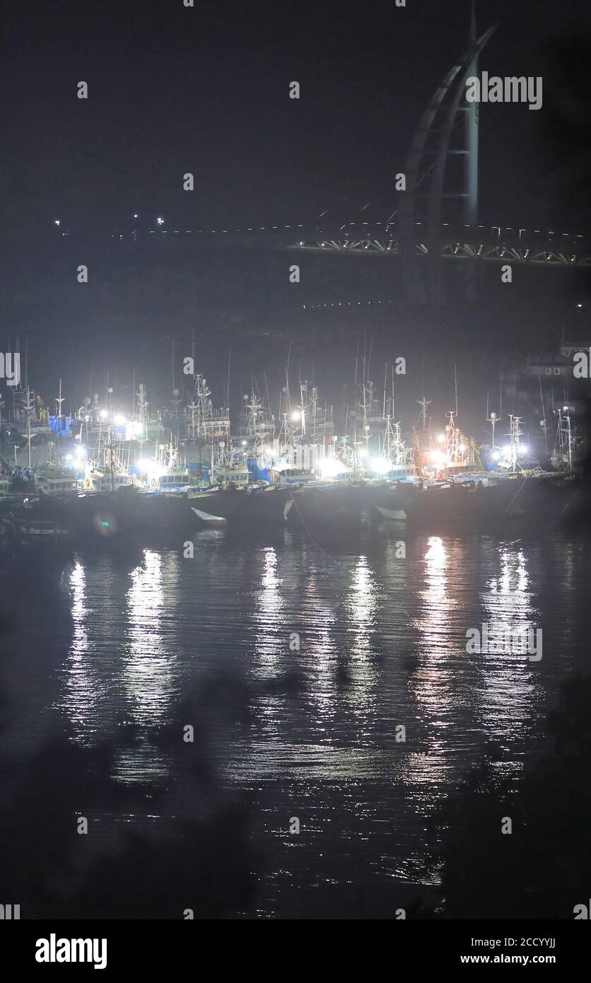 25th Aug, 2020. Lighted fishing vessels take shelter Fishing boats with ...