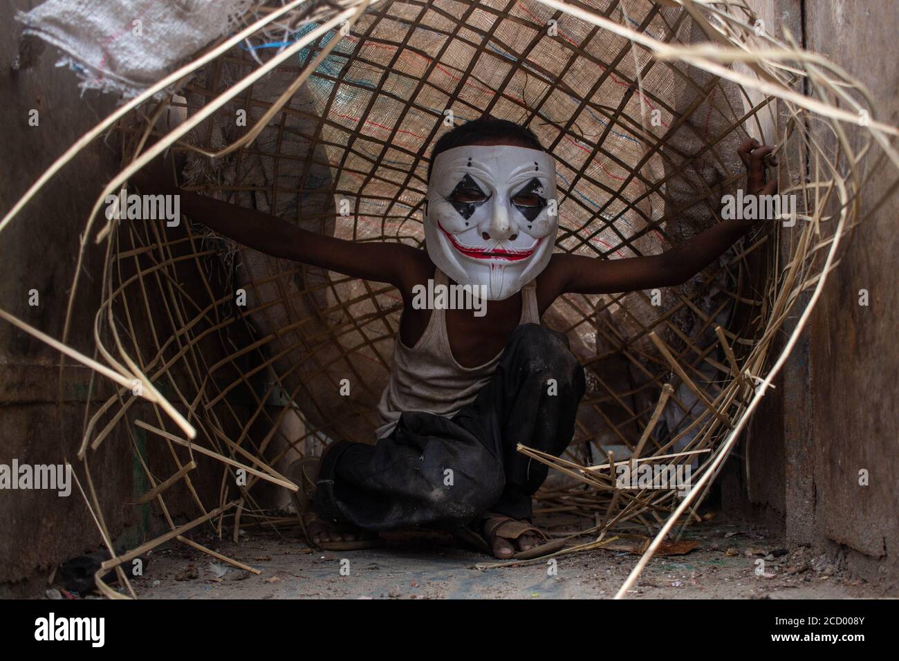 Dhaka, Dhaka, Bangladesh. 25th Aug, 2020. A boy poses for a photo ...