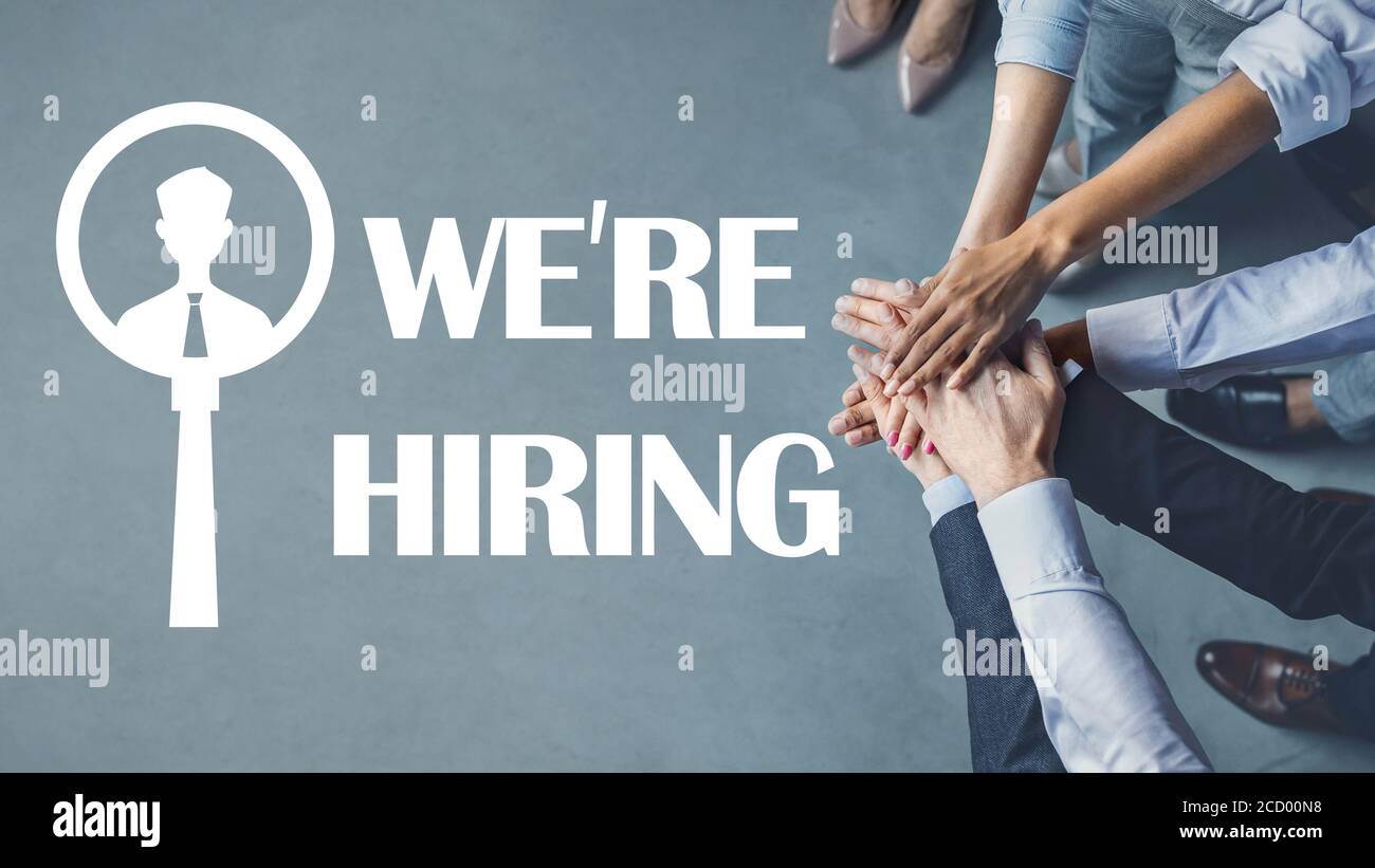 Business people putting hands hi-res stock photography and images - Alamy