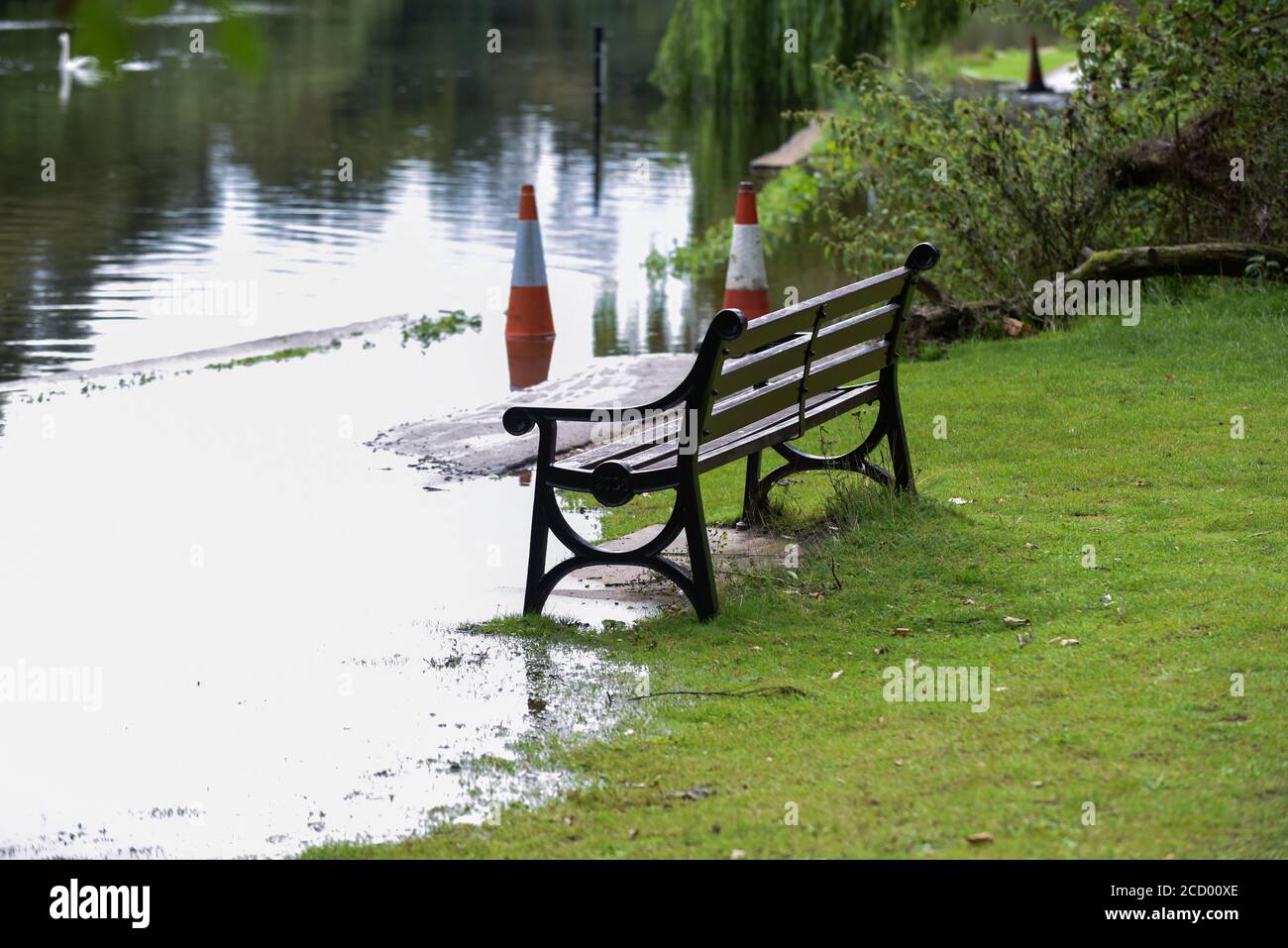 Flood water overflows from a lake during flooding after heavy rain and ...