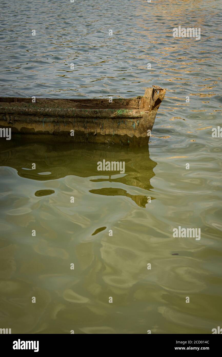 old wrecked boat half submerged at the shore of lake Stock Photo - Alamy
