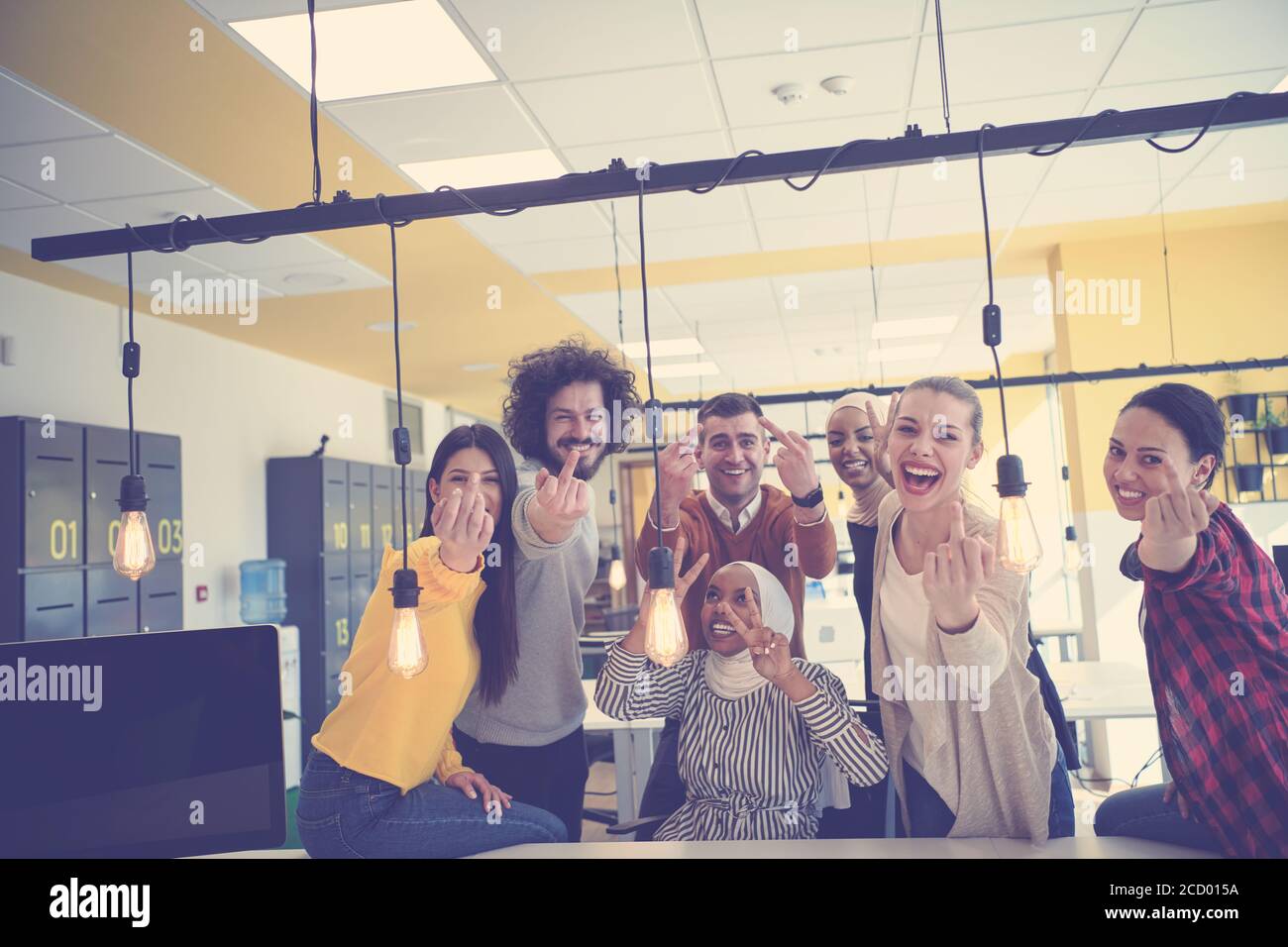 business team celebrating and have fun at modern coworking open space ...