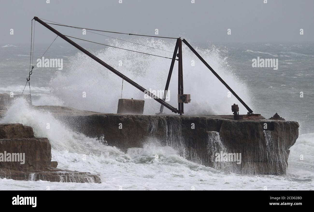Waves crash against the shoreline at Portland Bill in Dorset Stock ...