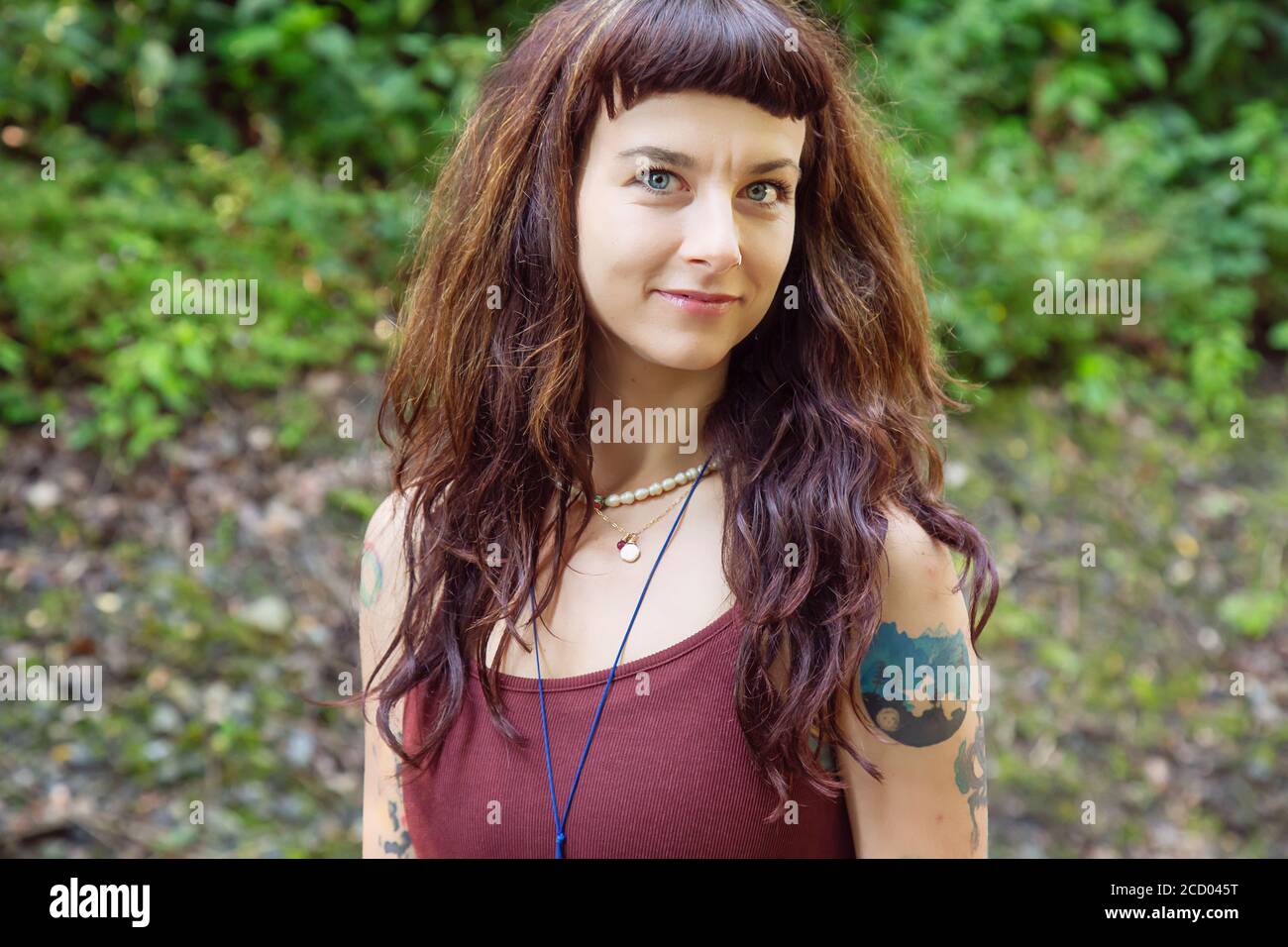 Portrait of beautiful woman in the forest Stock Photo - Alamy