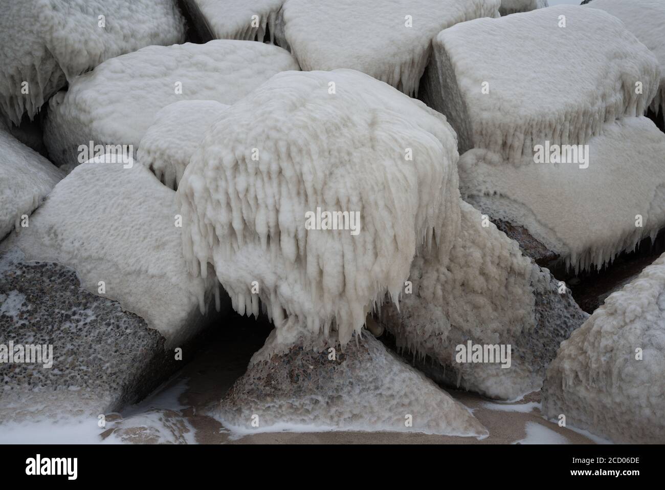 Grey scenery of coastal rocks covered with salt layers Stock Photo - Alamy