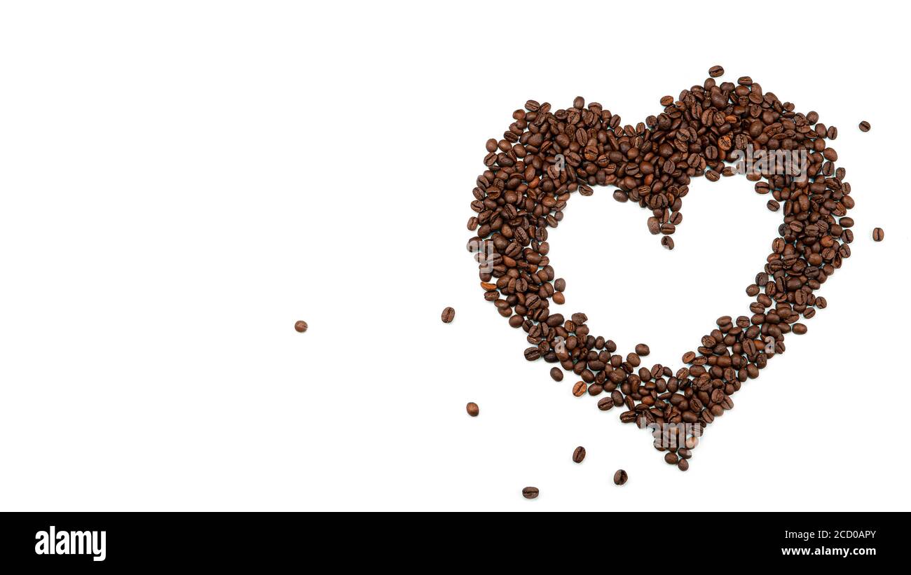 Heart made of coffee beans on a white background Stock Photo - Alamy