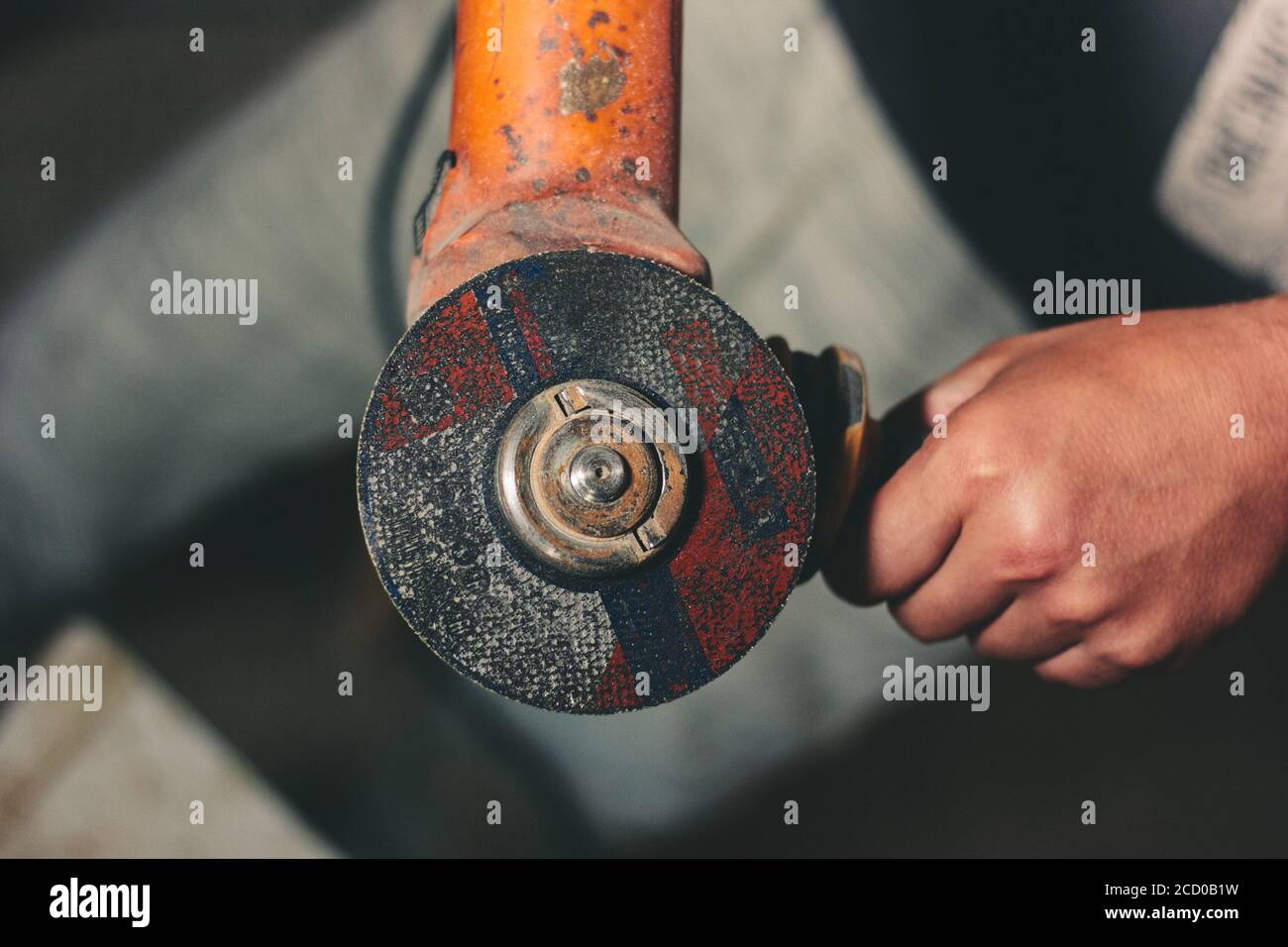 Angular grinding machine in a hands of carpenter. Great photo for your ...