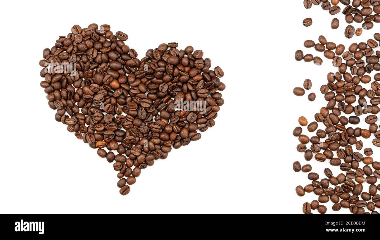 Heart made of coffee beans on a white background Stock Photo - Alamy