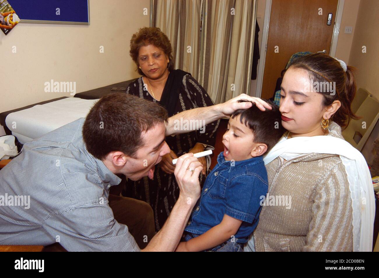 Two year old boy having development health check up with NHS ...