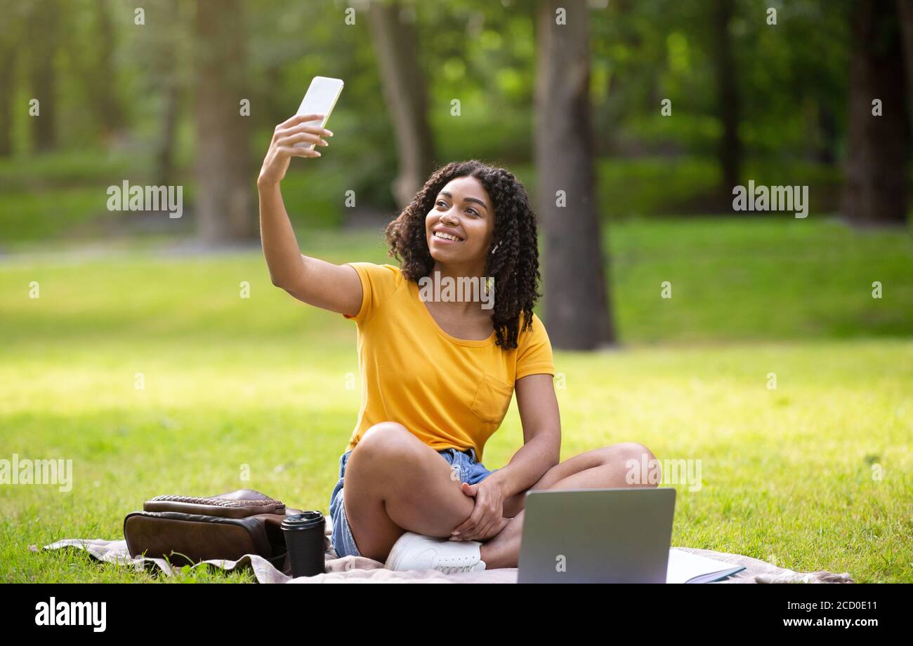 Taking picture with phone laptop hi-res stock photography and images ...