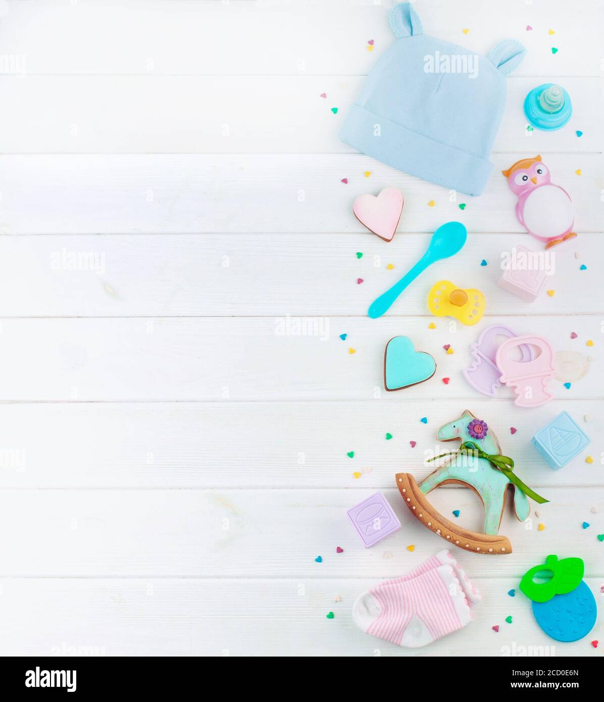 Baby shower party background: baby clothes and accessories on white ...