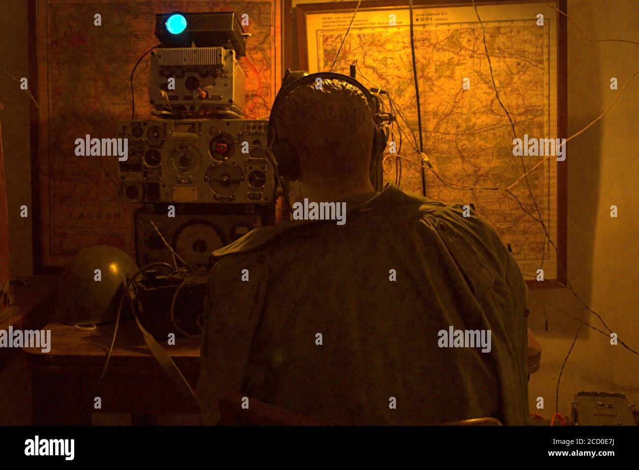 A man operating communication equipment used by different military ...