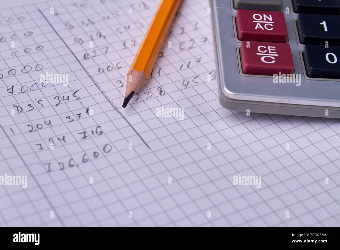 Close up accountant calculations with pencil Stock Photo - Alamy