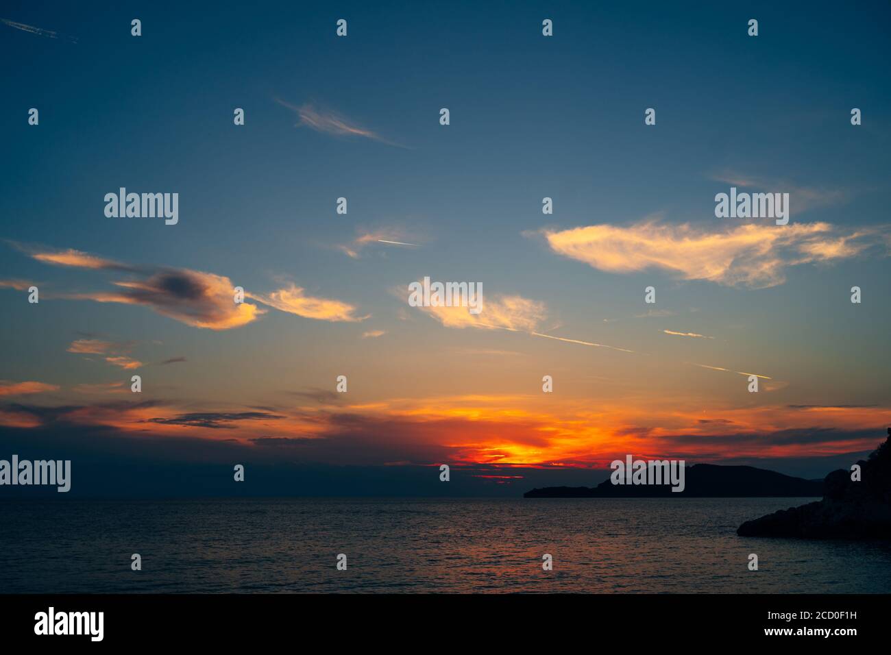 Fiery red sunset sky over the sea Stock Photo - Alamy