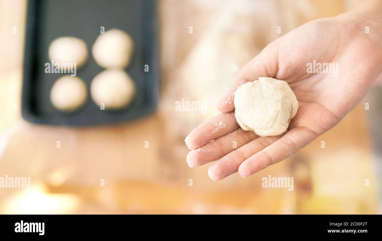 Young girl cooking. Female chef. Roll dough Stock Photo - Alamy