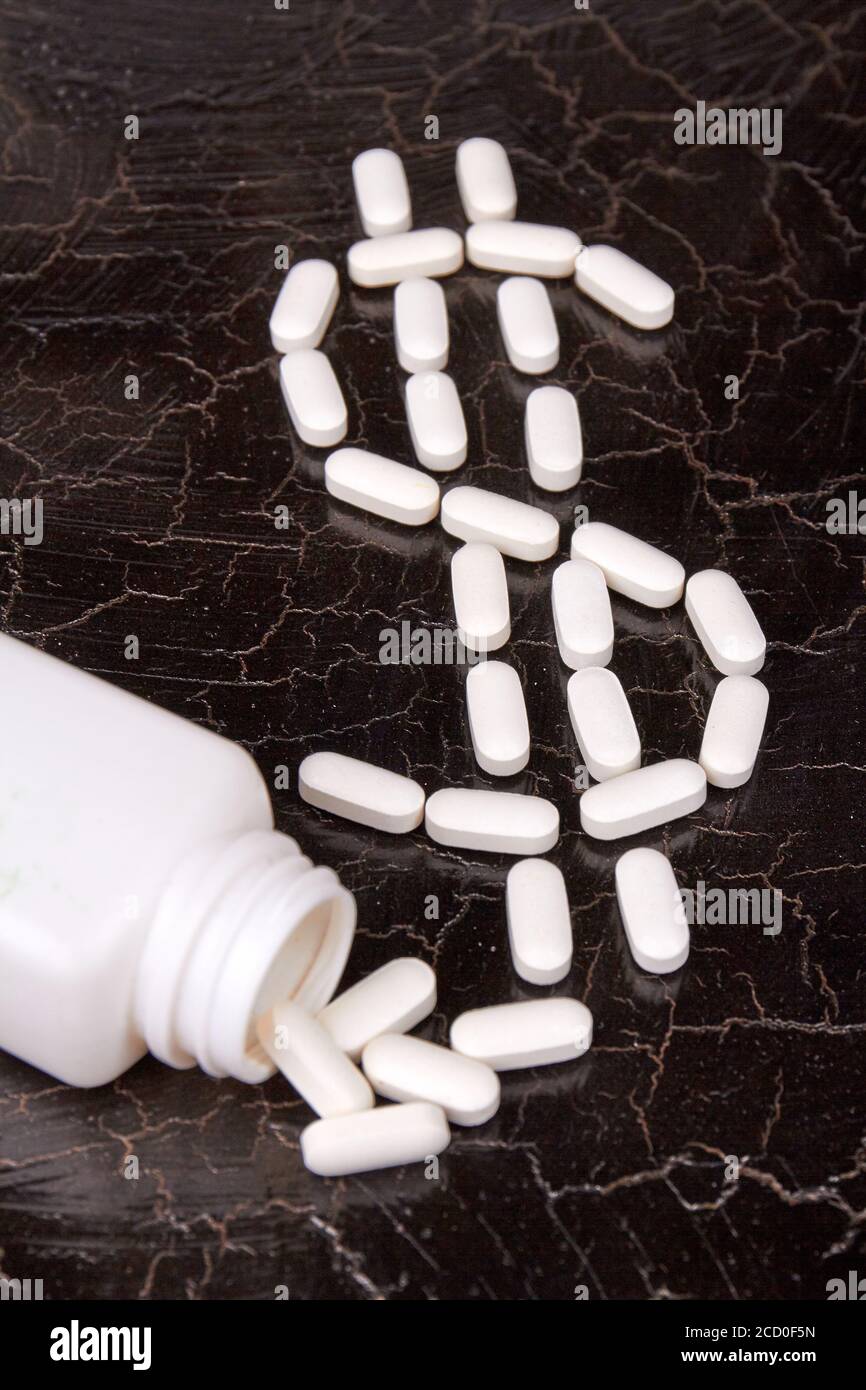 Dollar sign made of medicine pills Stock Photo - Alamy