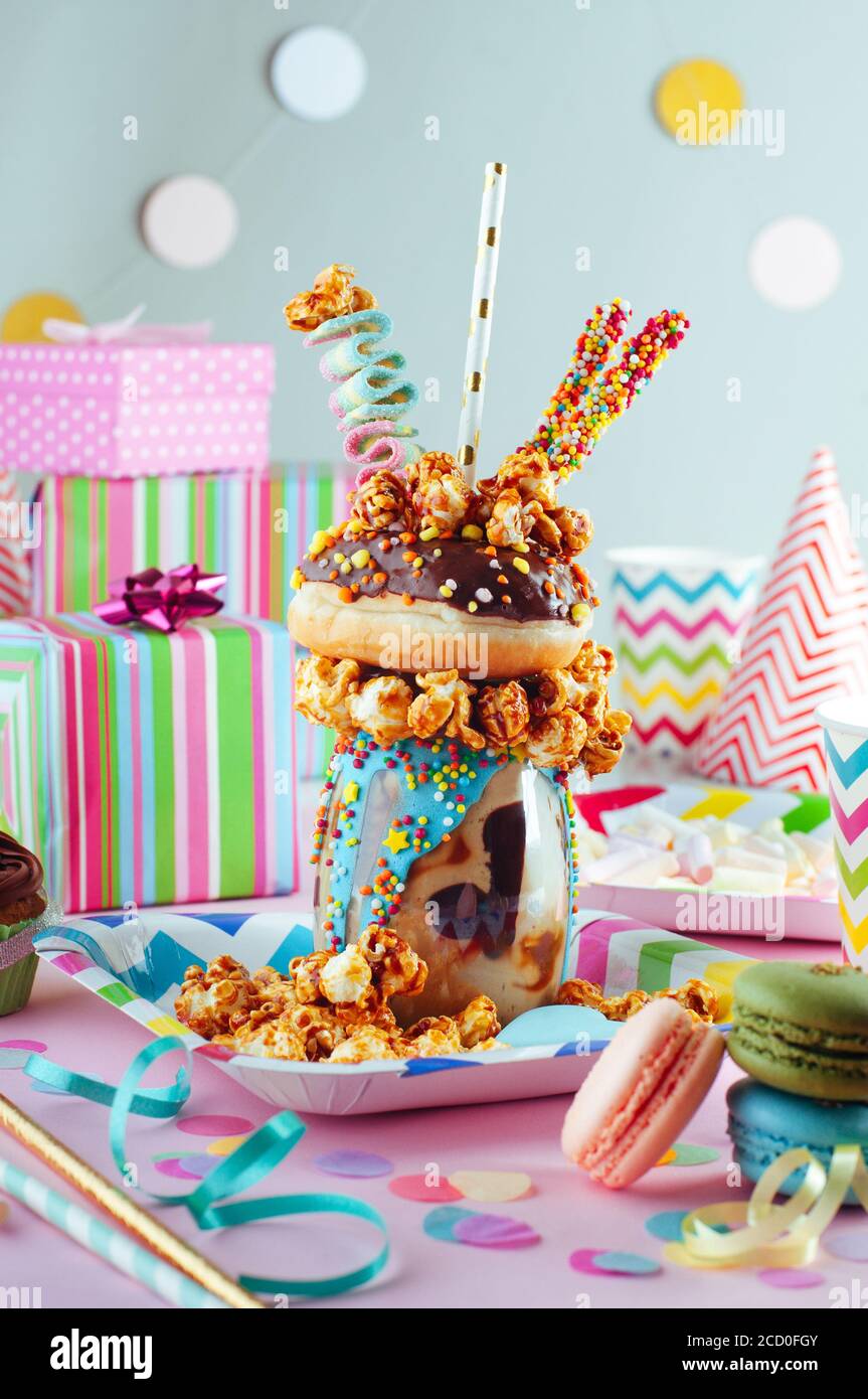 Kids party concept: Chocolate freak shake topping with donut and ...