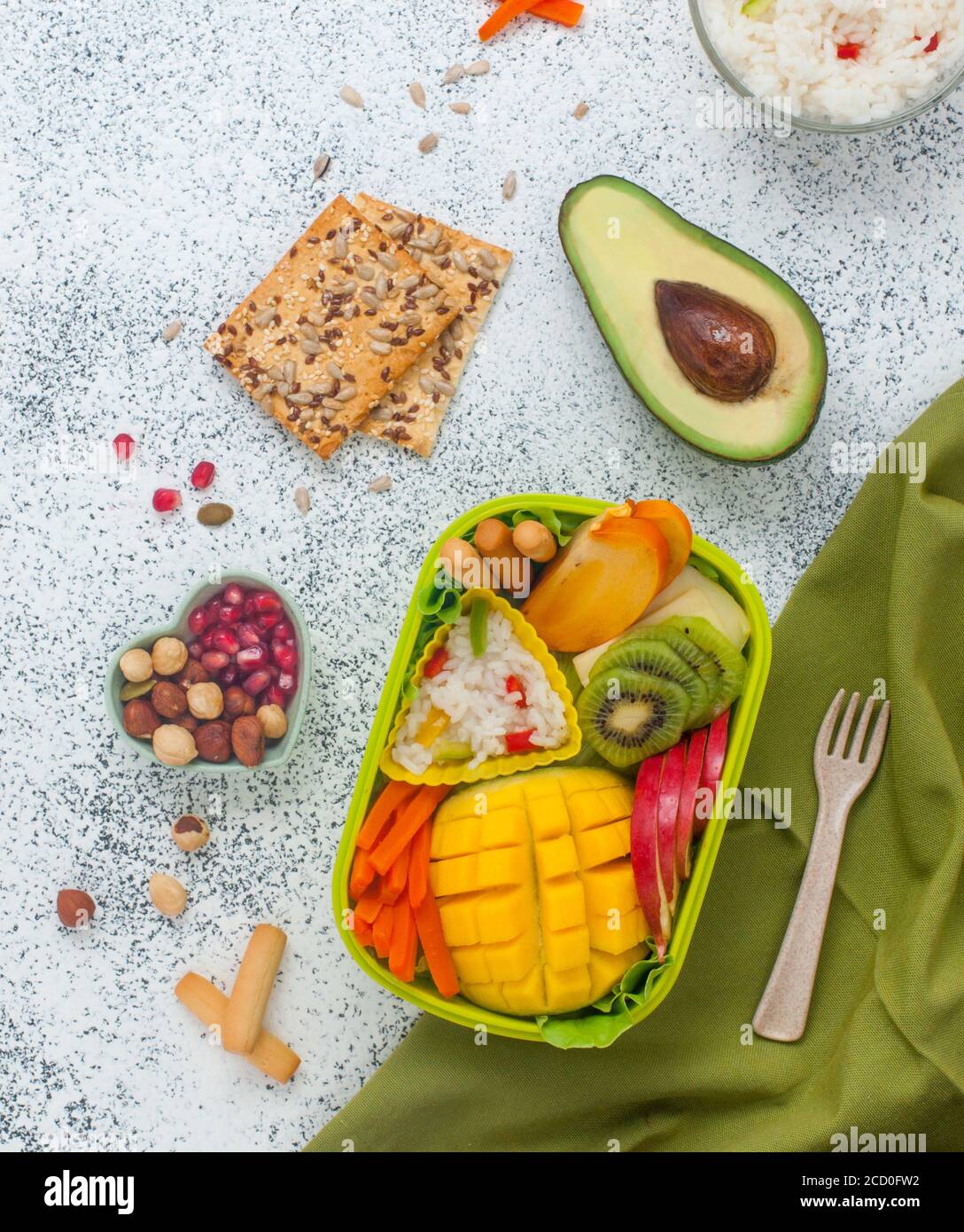 Healthy food concept: lunch box with rice, fresh fruits and vegetables ...