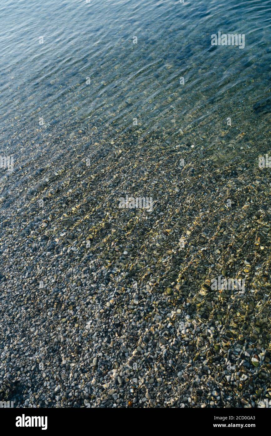 Pebble texture under sea water, water surface texture Stock Photo - Alamy