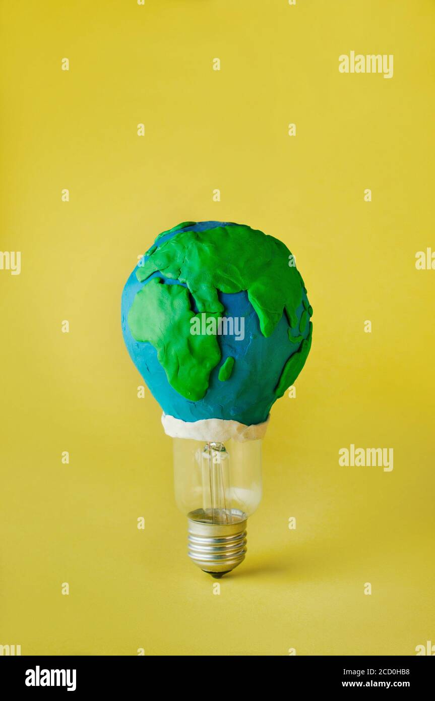 Earth Hour concept: electric lamp decorated as plasticine Earth planet ...