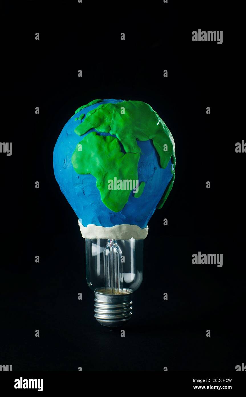 Earth Hour concept: electric lamp decorated as plasticine Earth planet ...