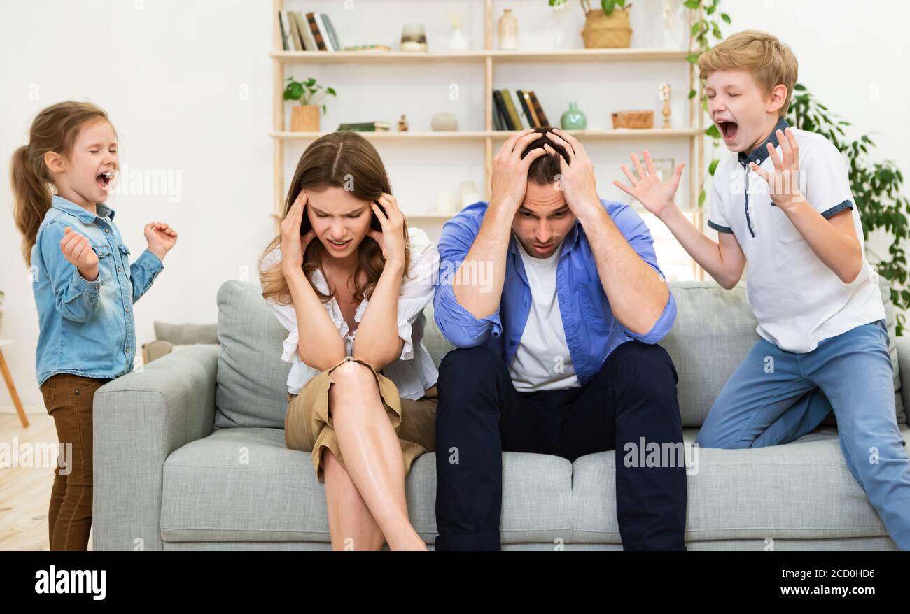 Uncontrollable Children Shouting Loudly Misbehaving Standing Near ...