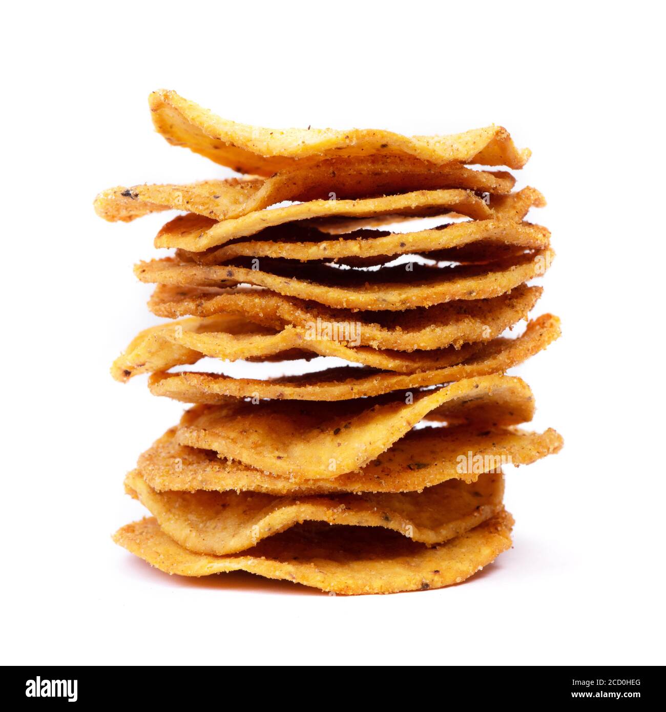 Heap of round nachos isolated on white background Stock Photo - Alamy