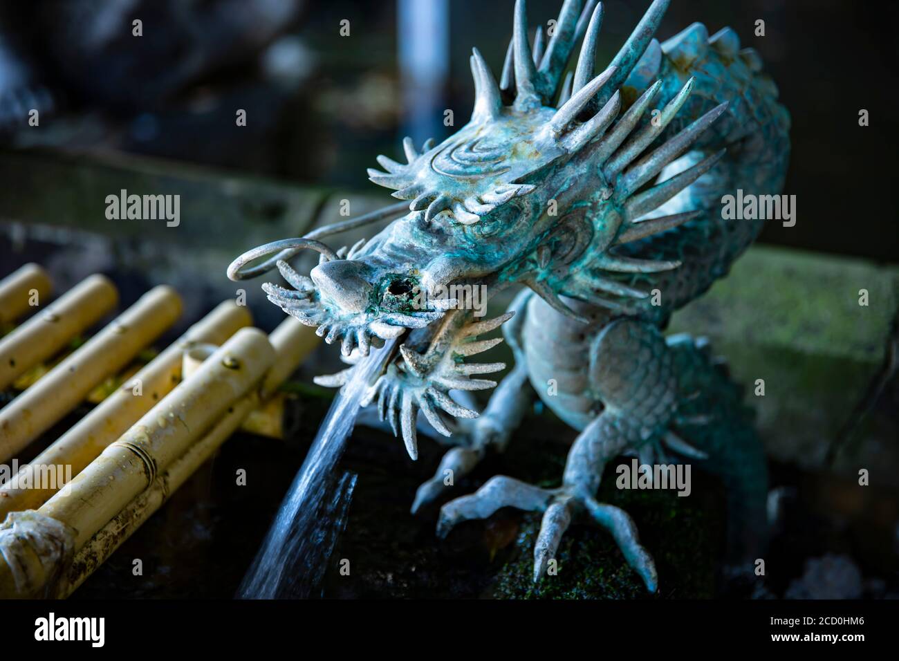 A statue of dragon at the chozuya at Meguro fudo temple in Tokyo ...