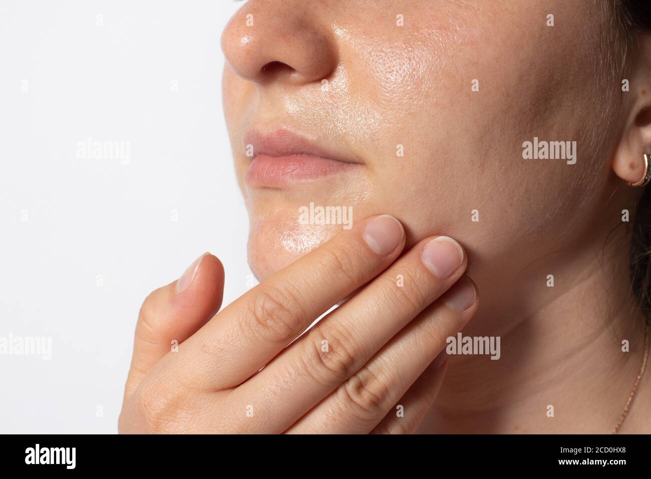 The woman puts oil on the skin and massages the face. Hydrophilic oil ...