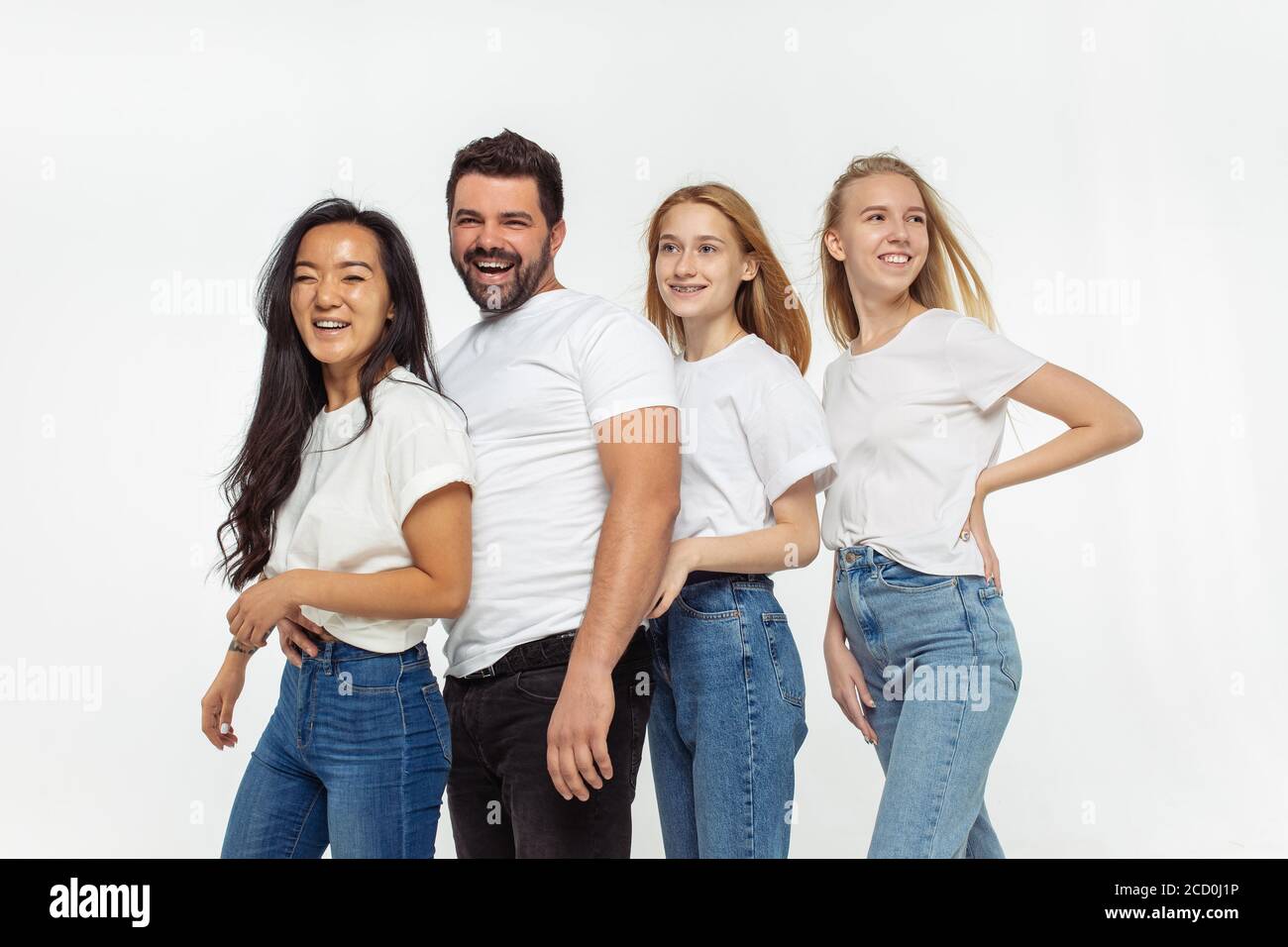 Group of adorable multiethnic friends having fun isolated over white ...