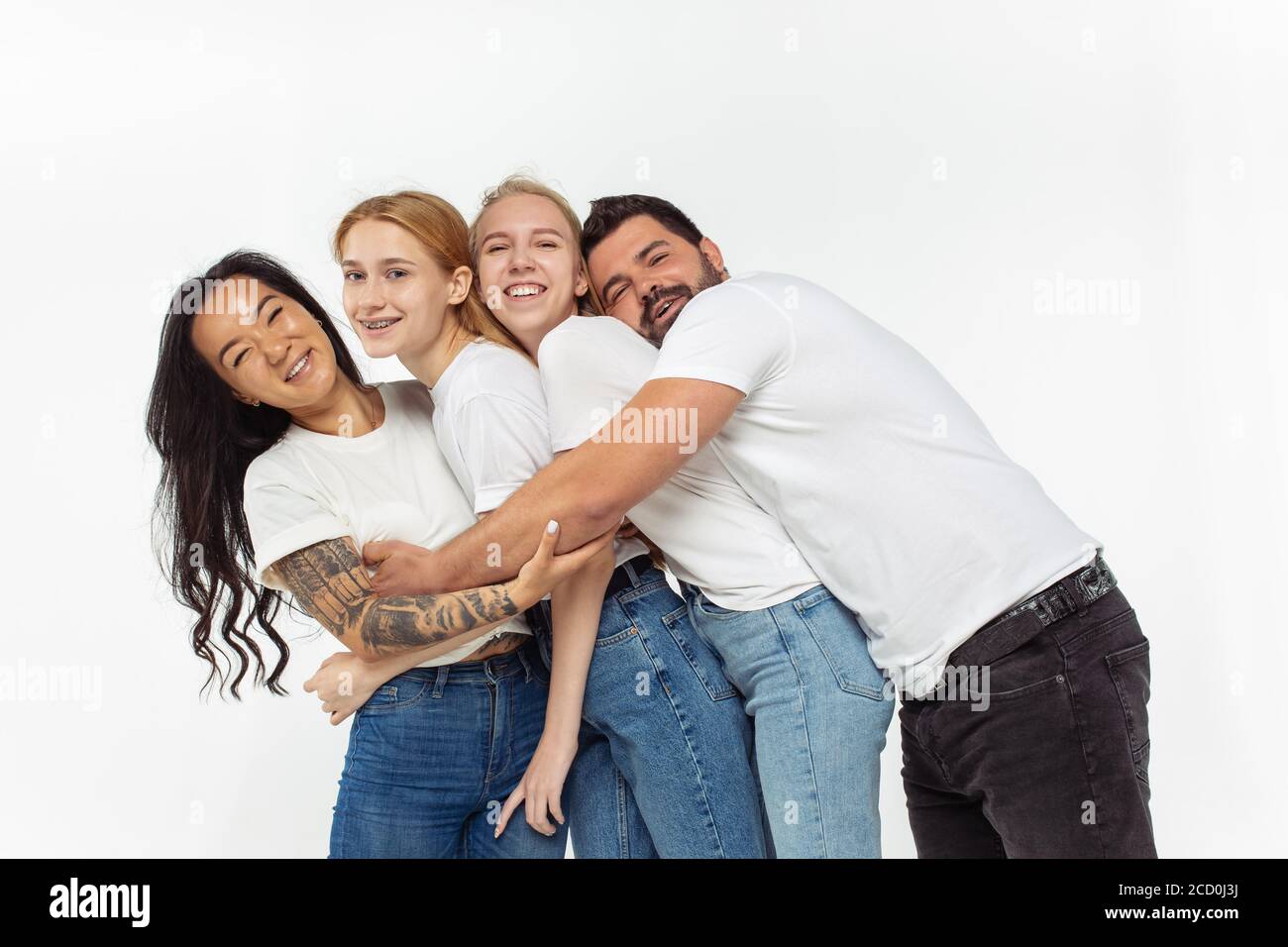 Group of adorable multiethnic friends having fun isolated over white ...