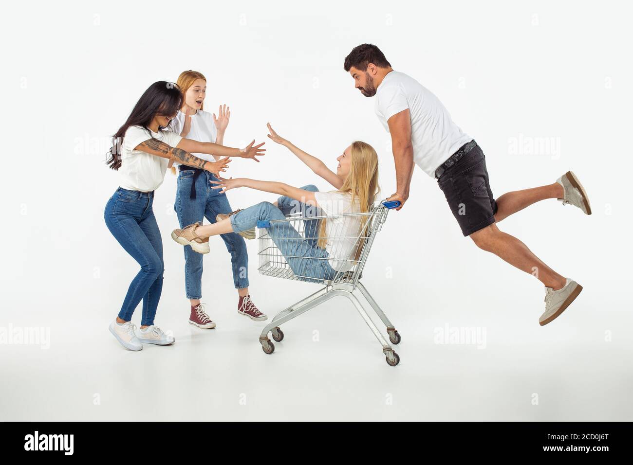 Group of adorable multiethnic friends having fun isolated over white ...
