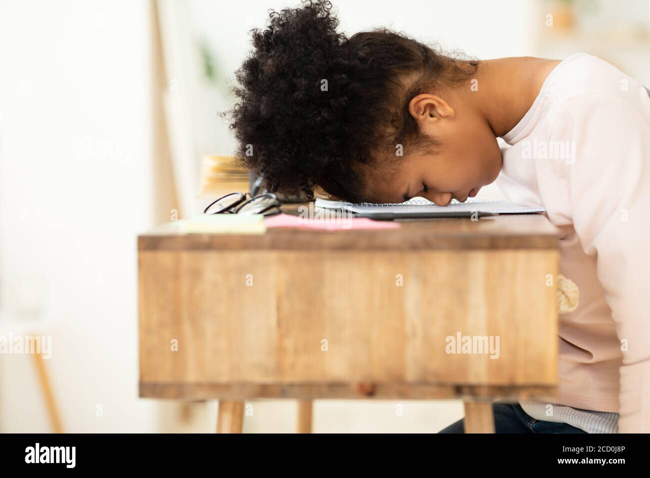 Overworked African Girl Resting Head On Desk Sitting Indoor Stock Photo ...