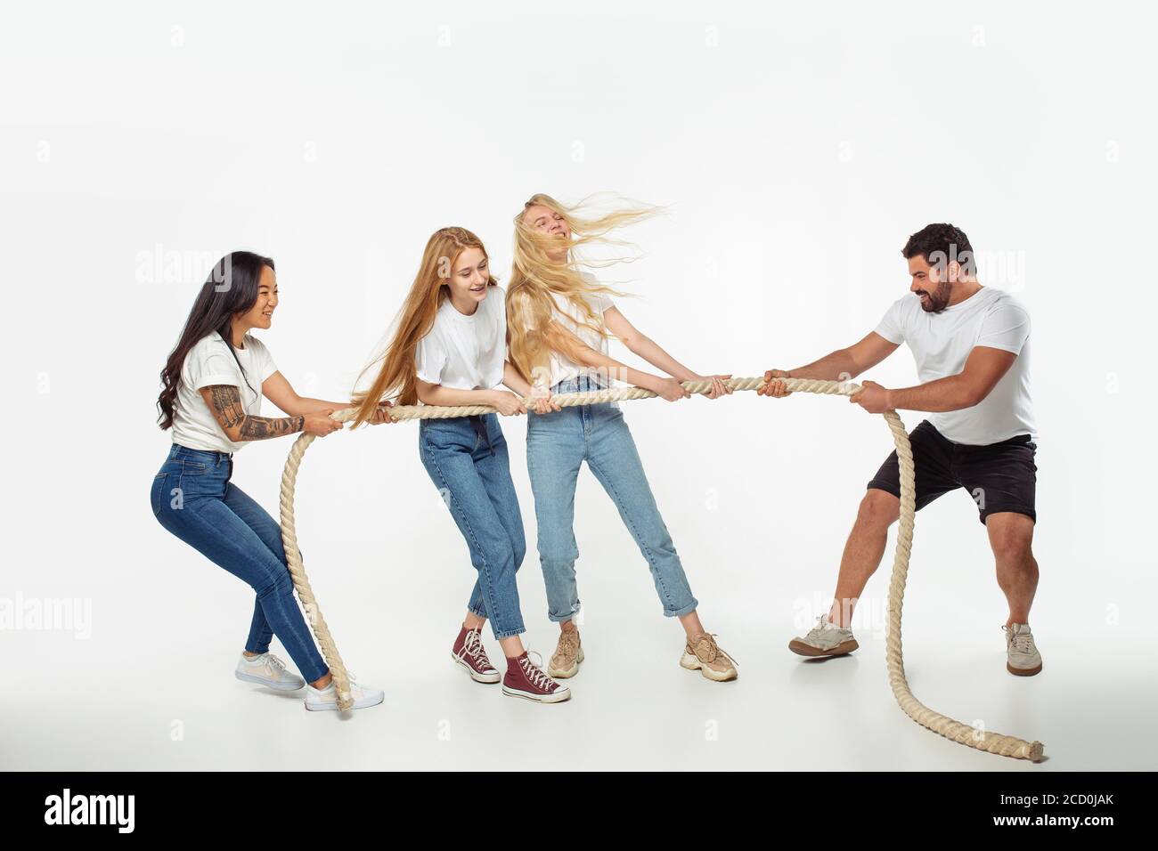 Group of adorable multiethnic friends having fun isolated over white ...