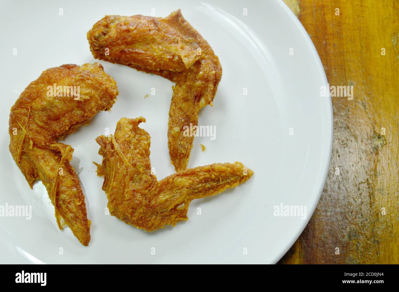 crispy fried chicken wing with herb on white plate Stock Photo - Alamy