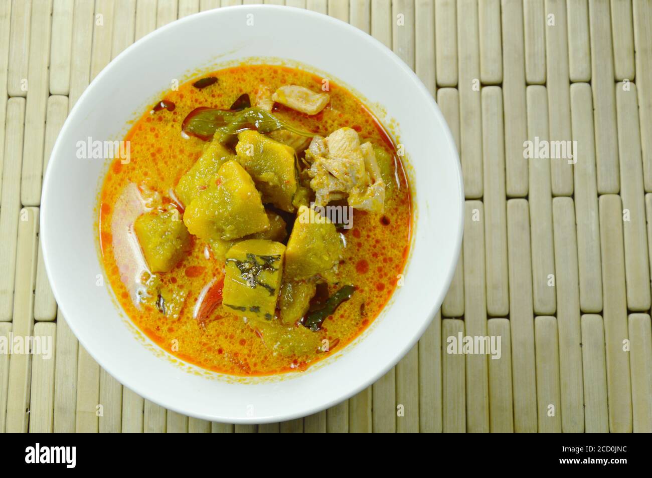 spicy boiled pumpkin with chicken in curry on bowl Stock Photo - Alamy
