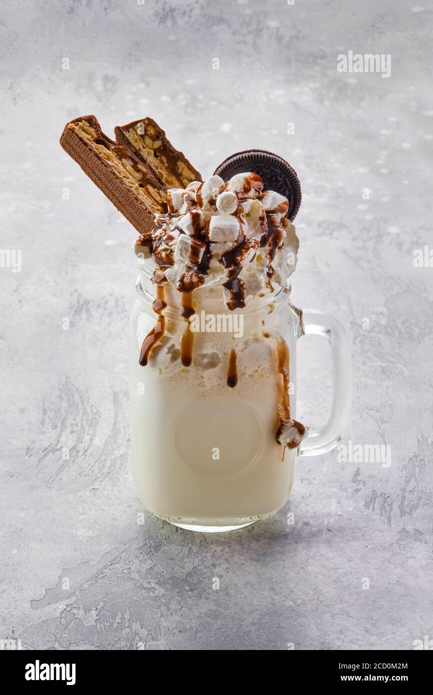 Milkshake with vegetable whipped cream foam, marshmallow and caramel ...