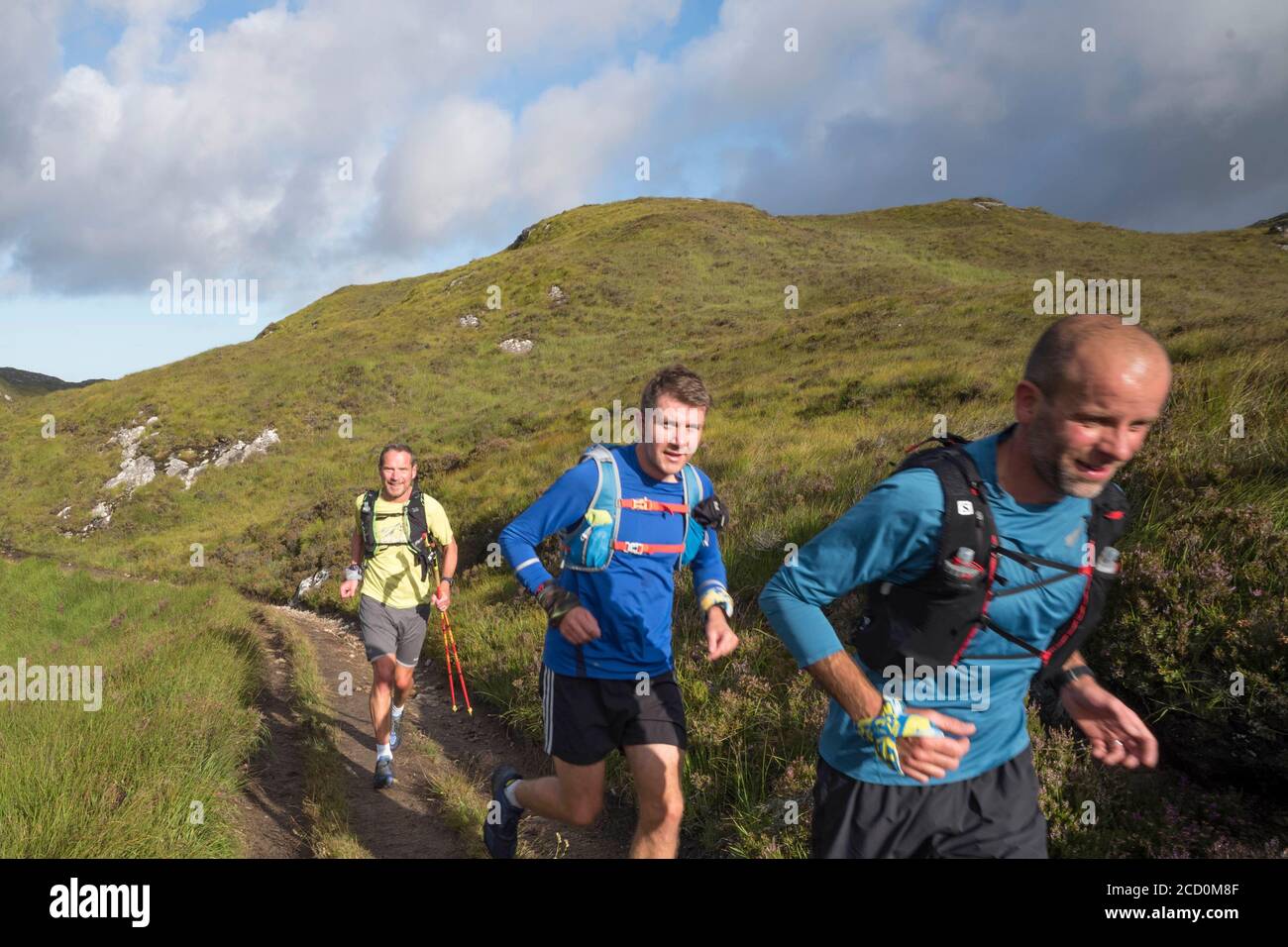 Men running on the path to Suilven mountain, Assynt, Scotland Stock ...