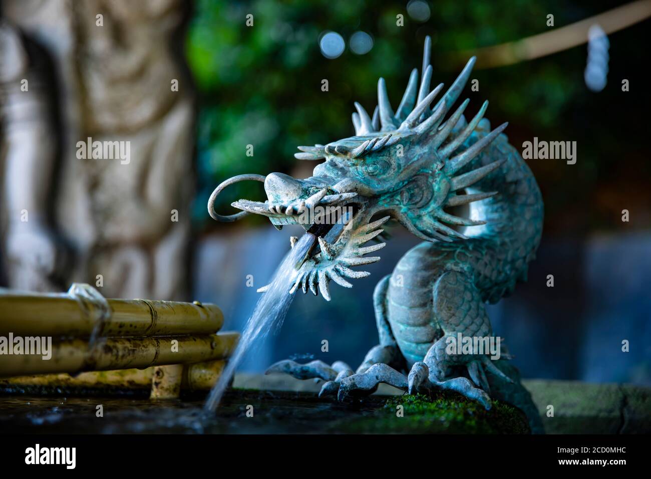 A statue of dragon at the chozuya at Meguro fudo temple in Tokyo ...