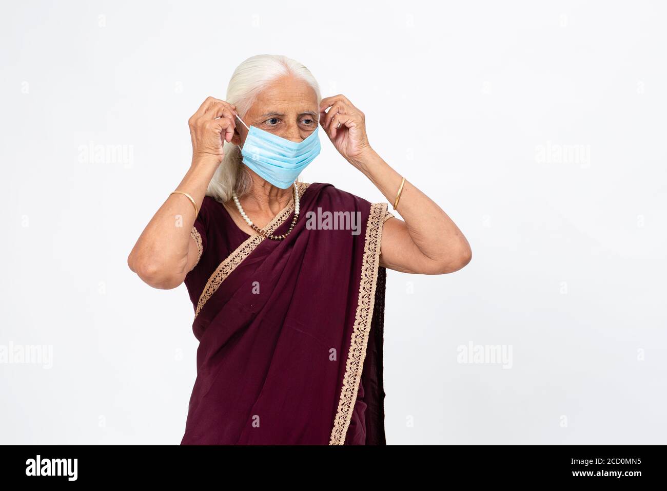 Mature Indian lady wearing Covid-19 protection mask, Elderly Indian ...