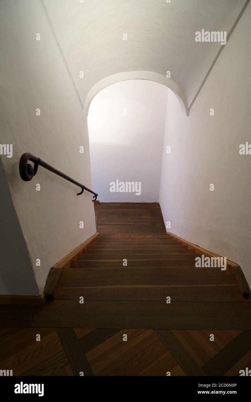 Vertical high-angle shot of a descending staircase with parquet ...