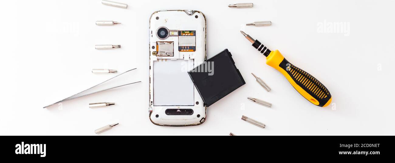 Smart phone repair isolated on white background Stock Photo - Alamy
