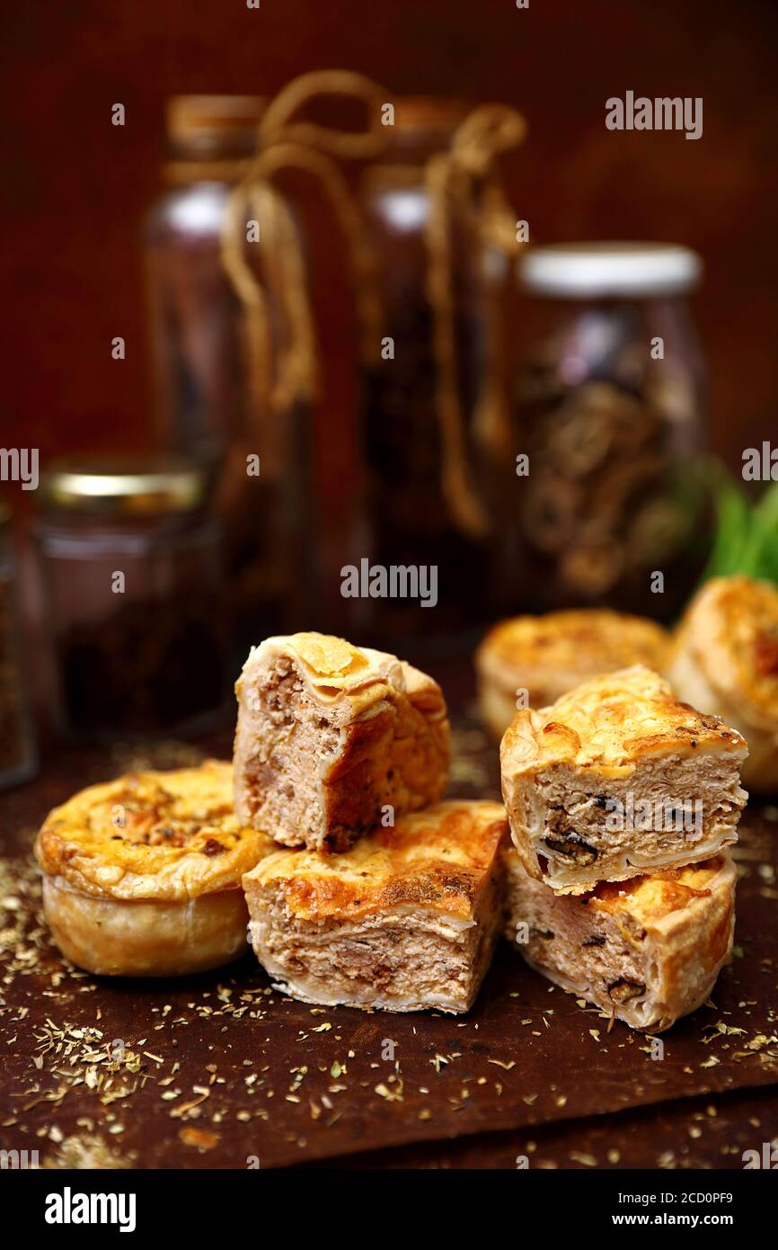 Healthy food with bread, egg, meat, bottles on dark brown background ...