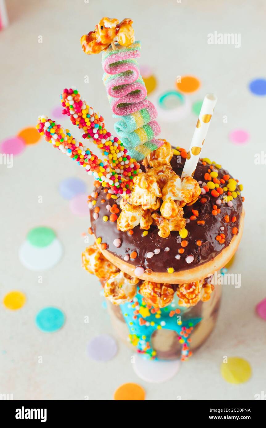 Kids party concept: Top view of chocolate freak shake topping with ...