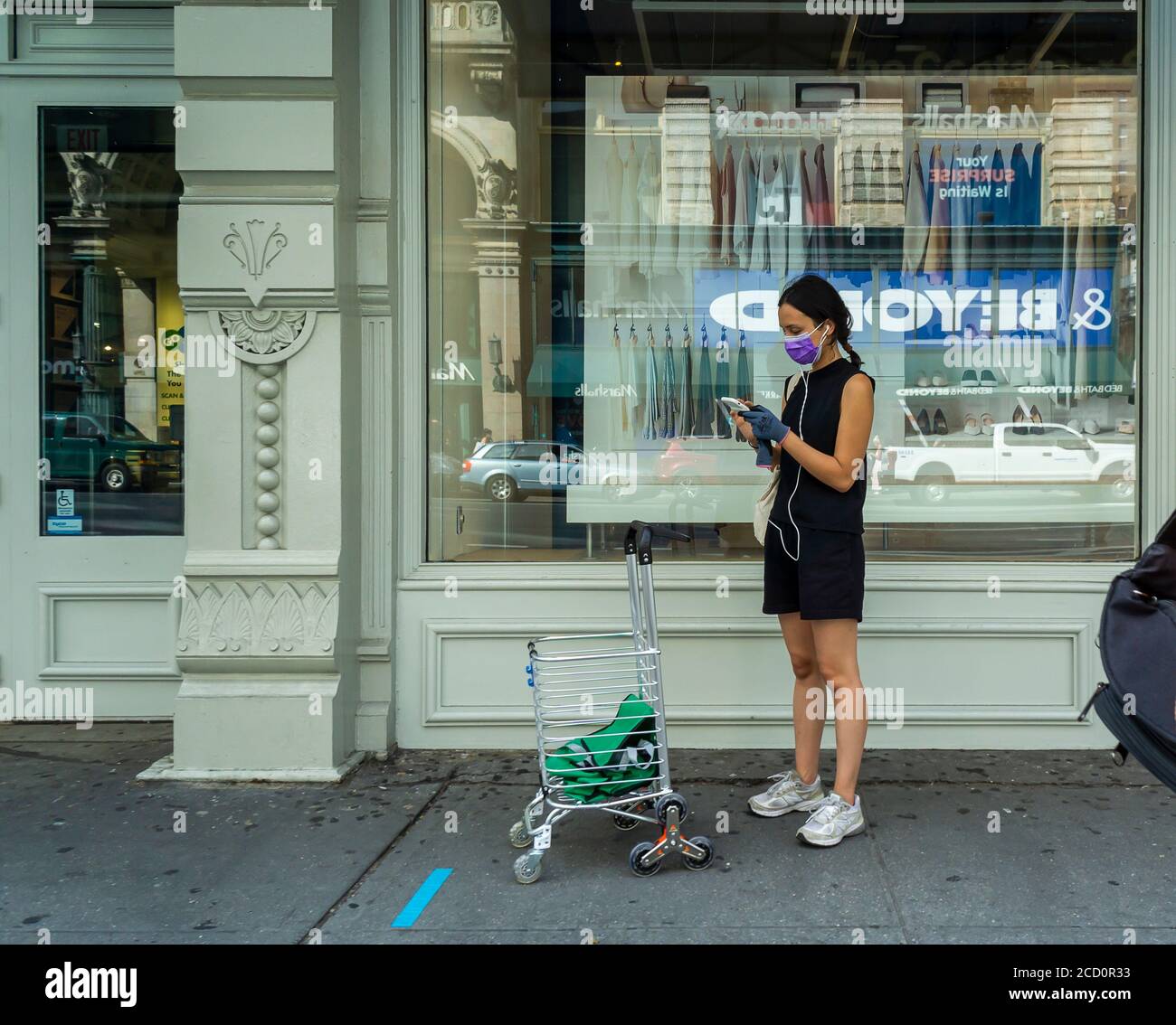 Masked woman in Chelsea in New York on Tuesday, August 11, 2020 ...