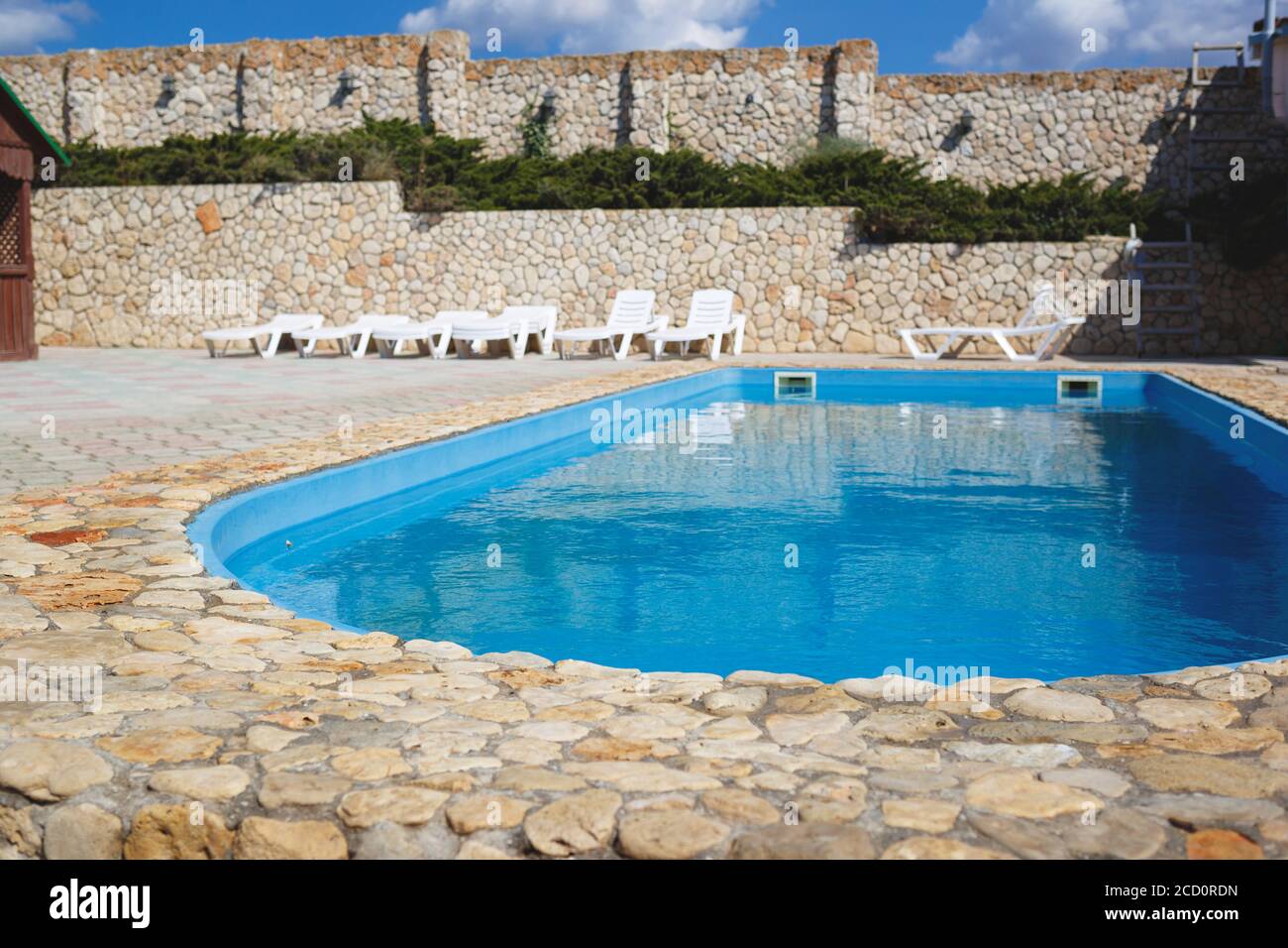 swimming pool in a recreation area in a rustic resort Stock Photo - Alamy