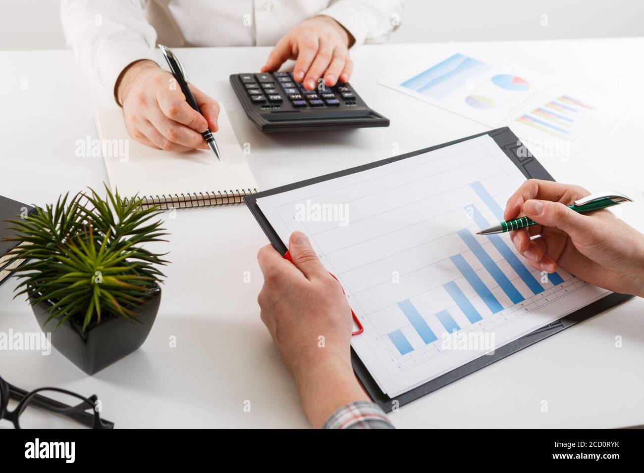 Business concept. Two business mans working and meeting with chart at ...