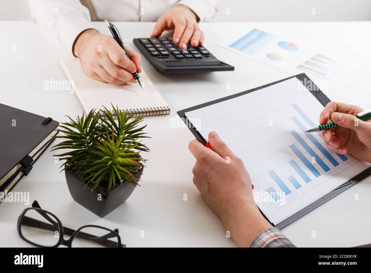 Business concept. Two business mans working and meeting with chart at ...