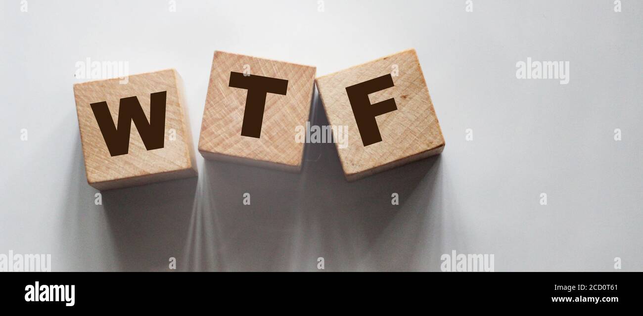 WTF abbreviation on wooden blocks, question concept, top view on grey ...