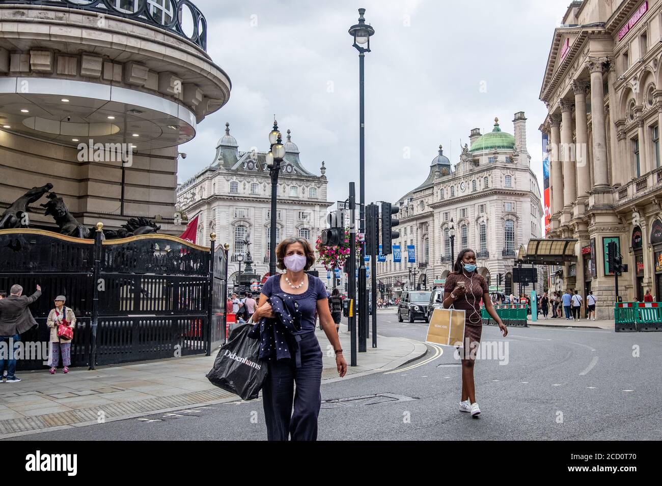 London- August, 2020: Shoppers wearing face masks in central London ...